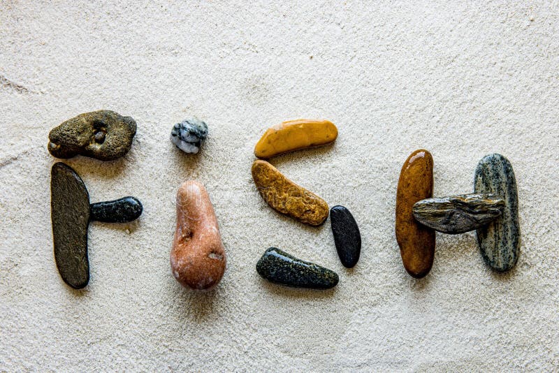 Word: FISH, Written Using Colored Stones on White Sand Stock Image ...