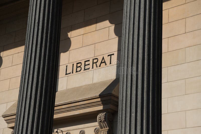 The Word Freedom Written in Latin on the Facade of an Old Building with ...