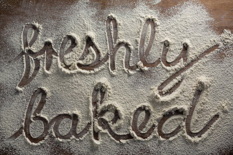 The Word Freshly Baked Written on Sprinkled Flour Stock Image - Image ...