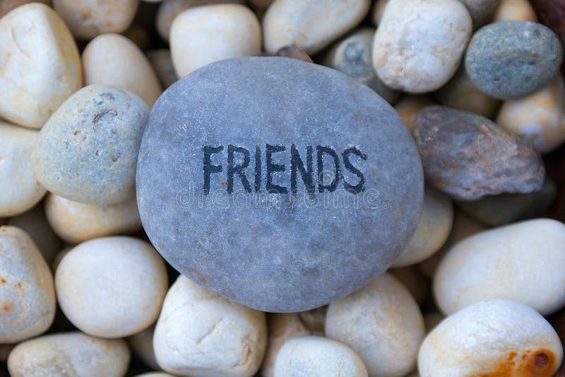 Word FRIENDS Written on a Grey Pebble among Smaller Pebbles Stock Image ...