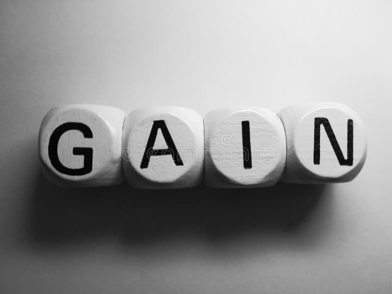 Word gain spelled on dice stock photo. Image of white - 122392328