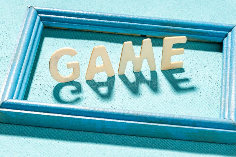 Word Game from Wooden Light Letters in a Frame for a Photo. Game within ...