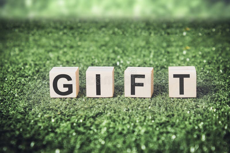 Word GIFT Made from Cubes or Blocks on Grass Background Stock Image ...