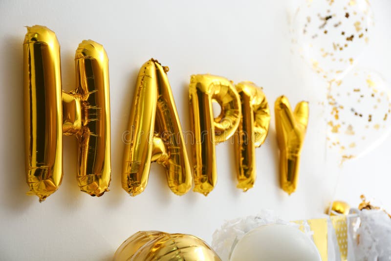 Word HAPPY Made of Golden Foil Balloons Letters on White Background ...