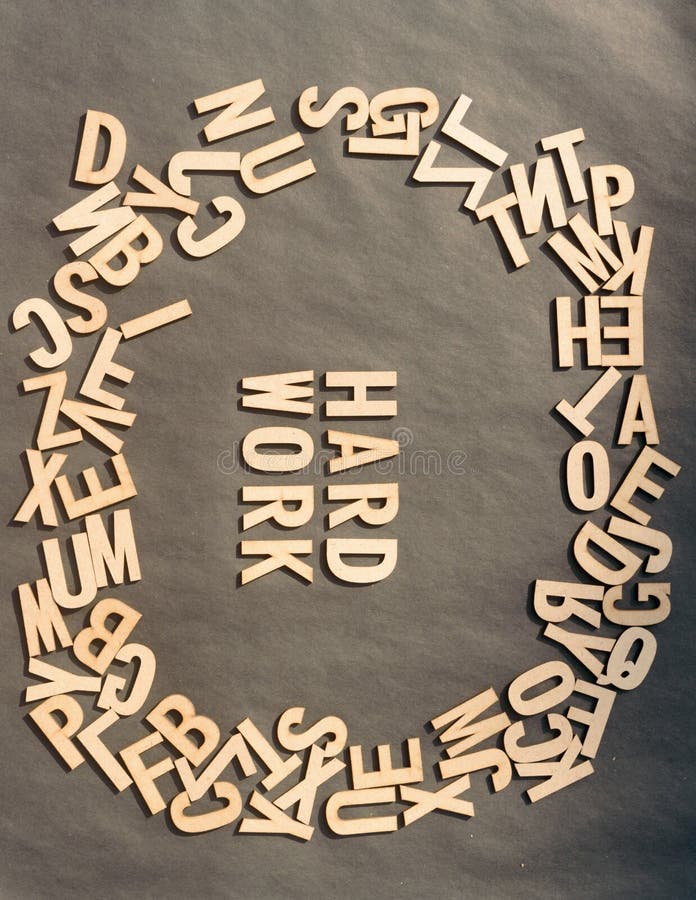 Word Hard Work in Wooden Cube Alphabet Letters Top View on a Rustic ...