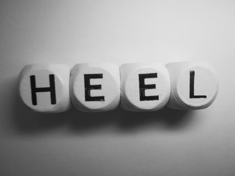 Word heel spelled on dice stock photo. Image of burns - 123025294