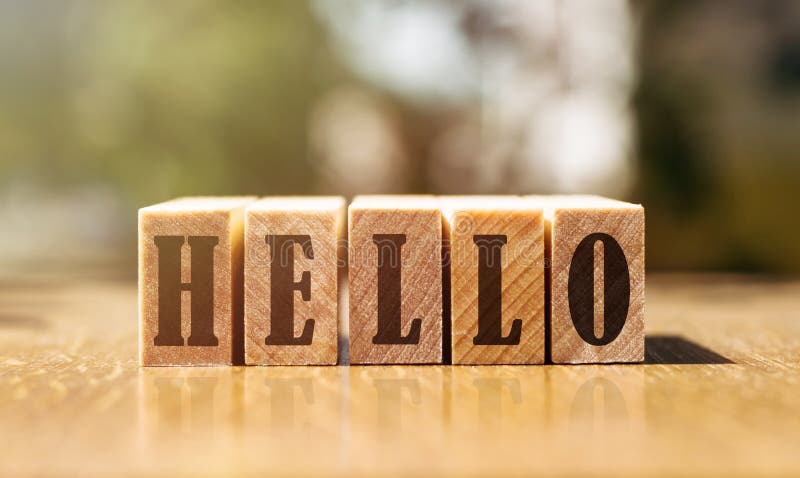 Word HELLO Made with Building Wooden Blocks on Table in Sunlight Stock ...