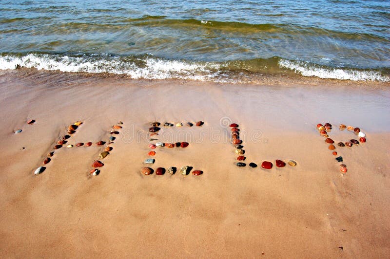 Word HELP on beach sand stock image. Image of inscripion - 1286583