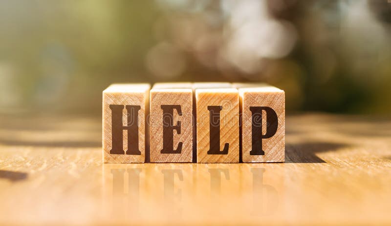 Word HELP Made with Building Wooden Blocks on Table in Sunlight Stock ...