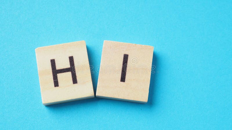 The Word HI from Wooden Cube Letters on a Blue Background Stock Image ...
