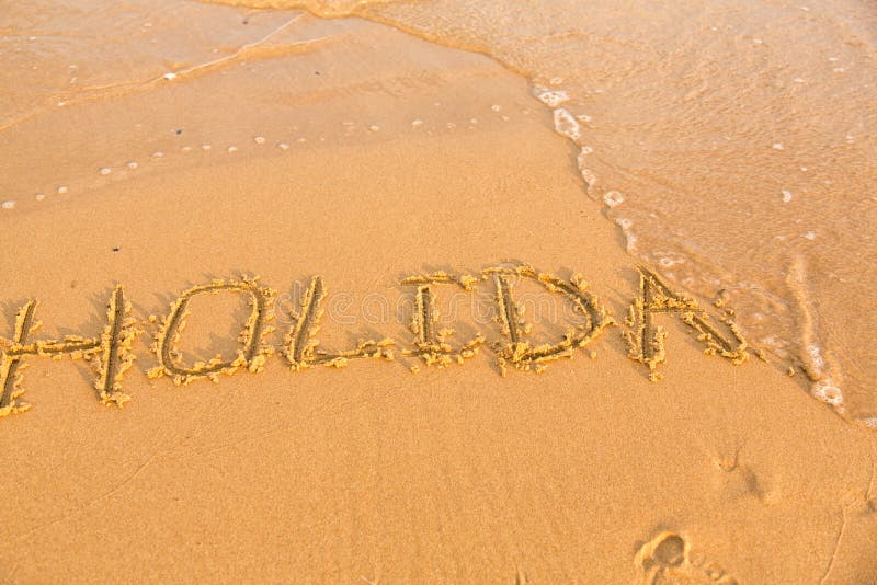 Word Holiday on the Yellow Sandy Beach Stock Photo - Image of beach ...