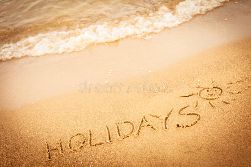 The Word Holidays Written in the Sand on a Beach Stock Photo - Image of ...