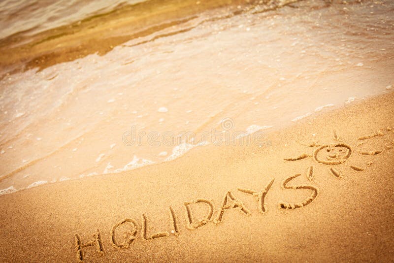 The Word Holidays Written in the Sand on a Beach Stock Image - Image of ...