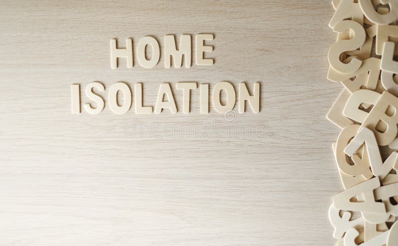 The Word HOME ISOLATION, Wooden Letters on Wooden Table. Stock Photo ...