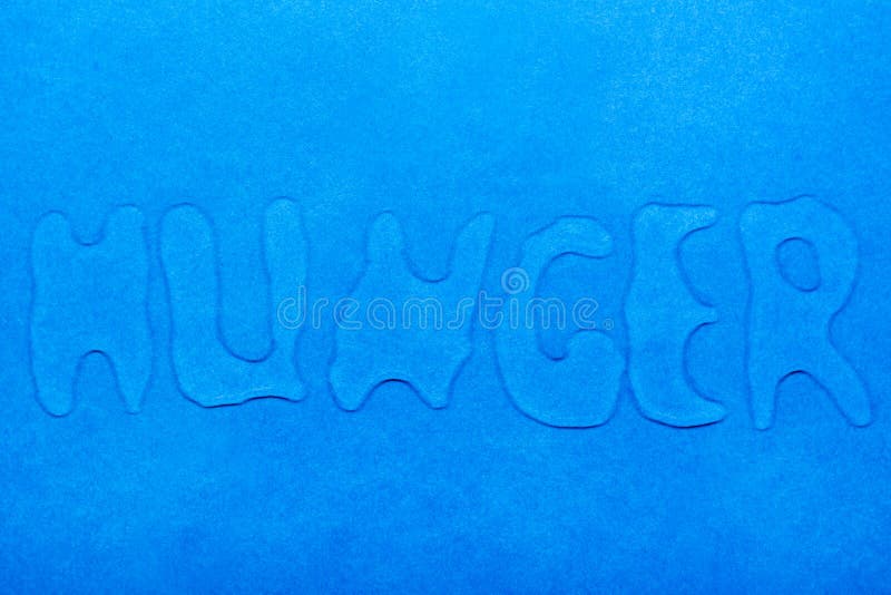 The Word `hunger` is Written with Water Droplets and Water Droplets on ...