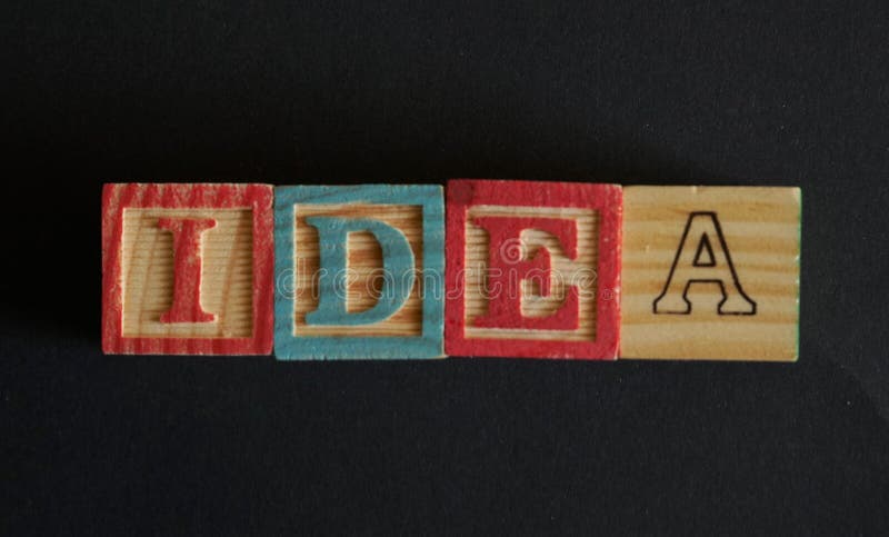 Word Idea Written Using Wooden Cubes on Black Background Stock Photo ...