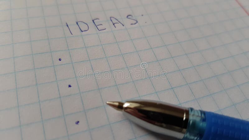 Word Ideas on Checkered Paper and Blue Pen Stock Photo - Image of ...
