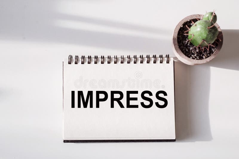 The Word of IMPRESS on a Notebook Stock Image - Image of business ...