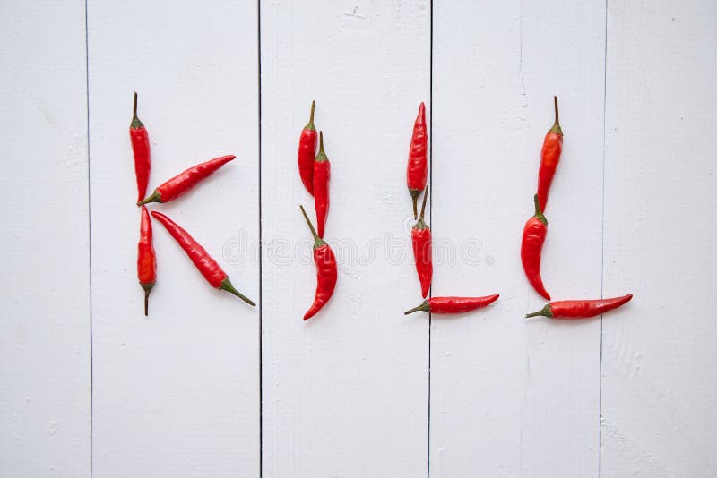A Word KILL Formed with Small Red Chilli Peppers. Placed on White ...