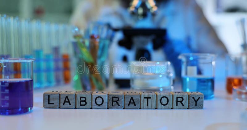 Word Laboratory from Cubes Against Chemist with Microscope Stock Video ...