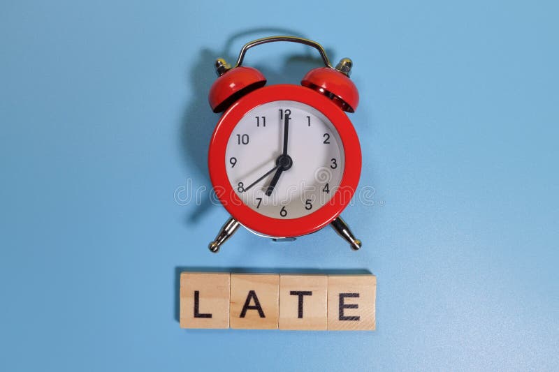 Word Late and Alarm Clock on Blue Background Stock Image - Image of ...