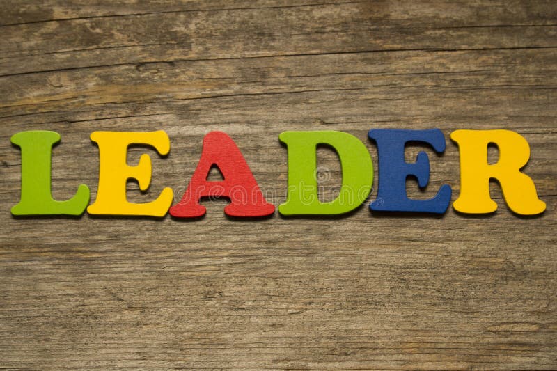 Word LEADER Made from Small Golden Letters on the Brown Backgrou Stock ...