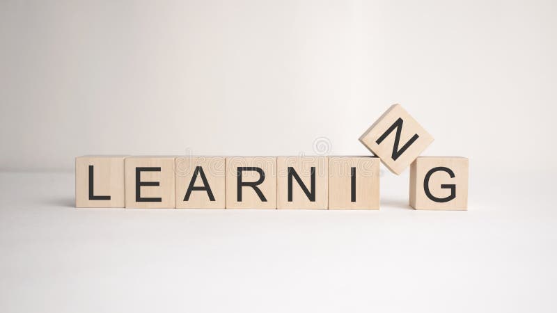 The Word Learning is Written on Wooden Cubes on a Light Background ...