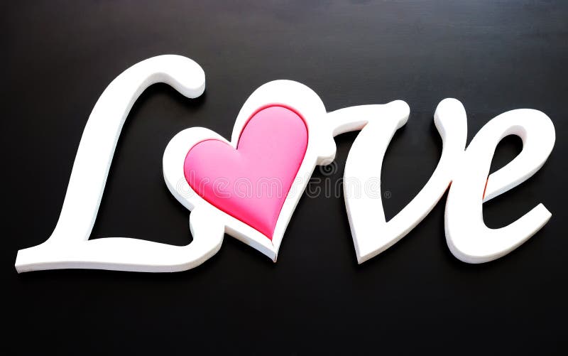 The word love on a black stock photo. Image of symbol - 64706278