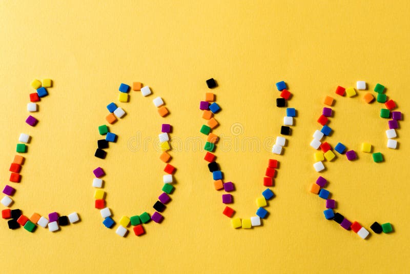 The Word Love Drawn with Multicolored Small Mosaic on Yellow Background ...
