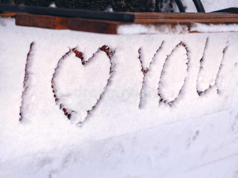The Word Love is Drawn with Your Finger on the Snow Surface. Stock ...
