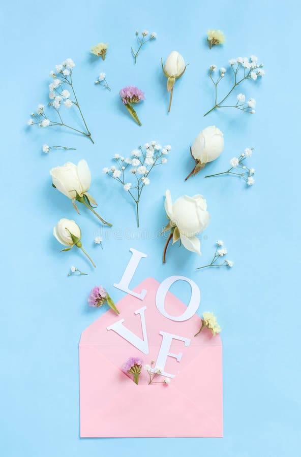 Word LOVE, Flowers and Pink Envelope on a Light Blue Background Stock ...