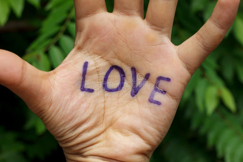 Word Love on Hand and Blur Tree Background. Stock Photo - Image of ...
