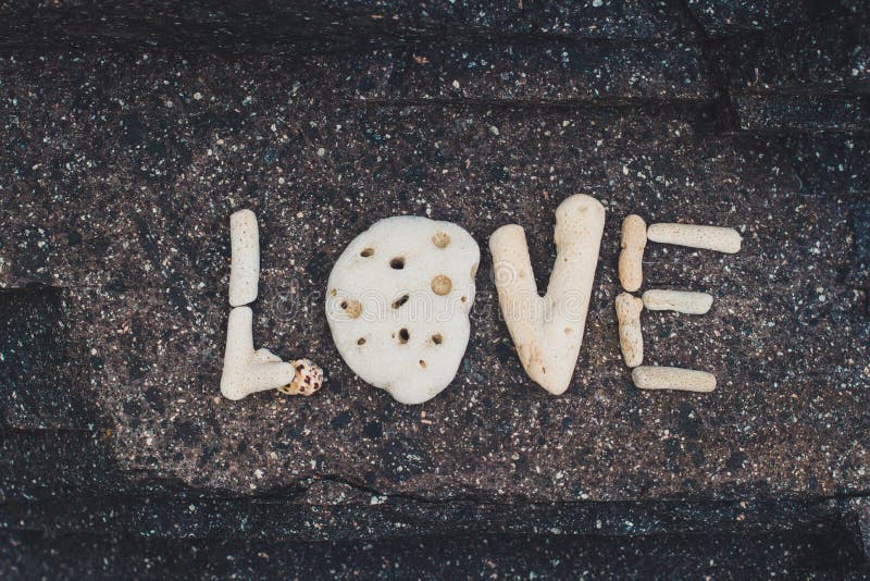 Word Love Made of Shells Collected on a Granite Stone Stock Image ...