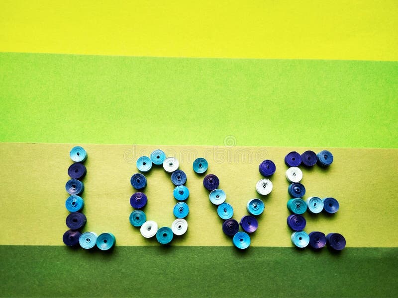 The Word Love from Paper Tapes on a Green Background Stock Photo ...