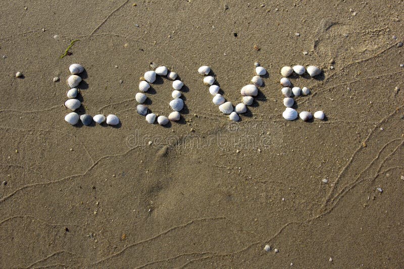 Word Love from White Different Shells in the Sand Stock Photo - Image ...
