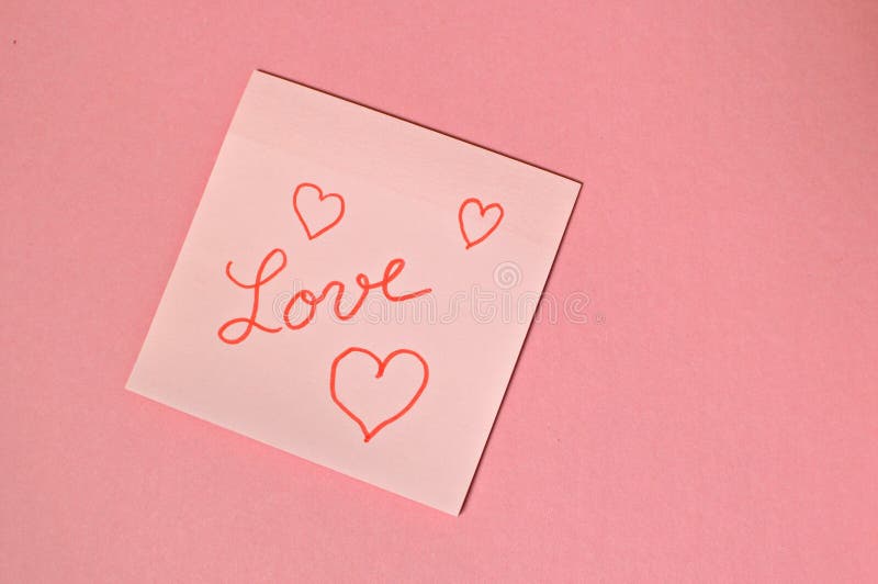 The Word Love Written by Hand and Put on the Pink Table Stock Image ...