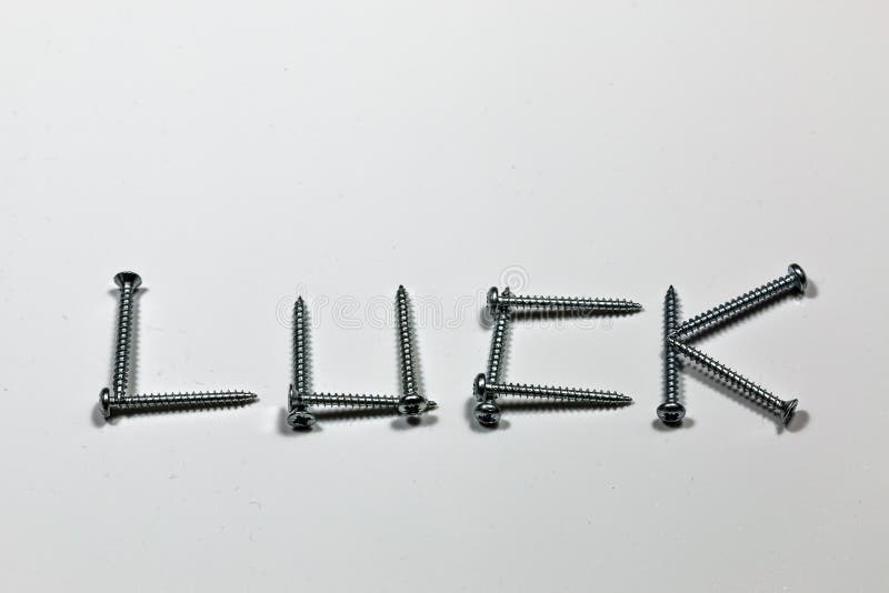 The Word Luck Written with Screws on a White Background with ...
