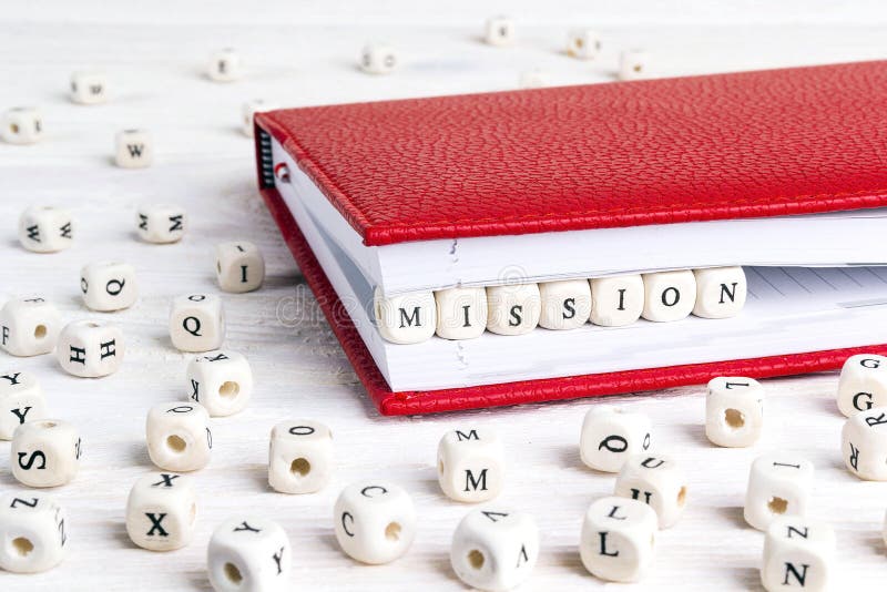 Word Mission Written in Wooden Blocks in Red Notebook on White W Stock ...