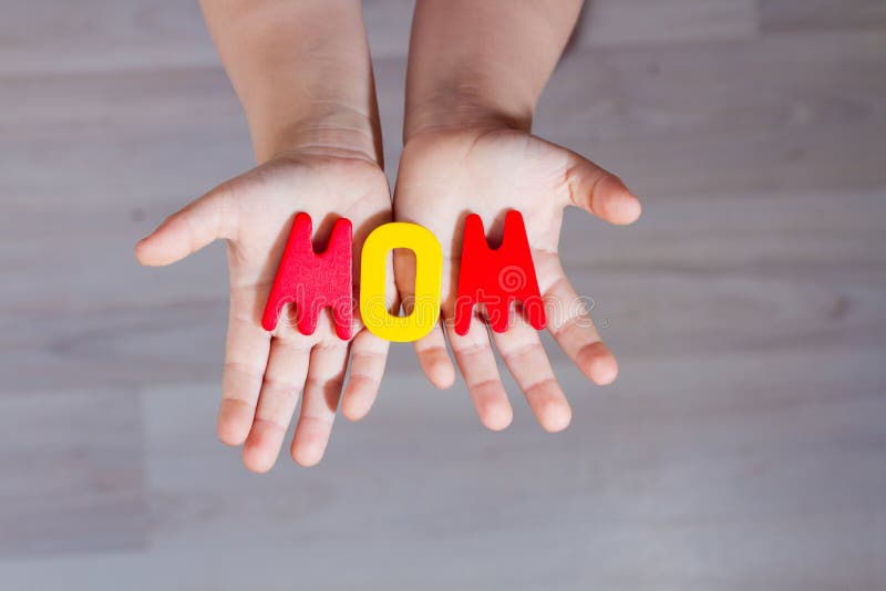 Word mom stock image. Image of love, hands, colored, baby - 61886809