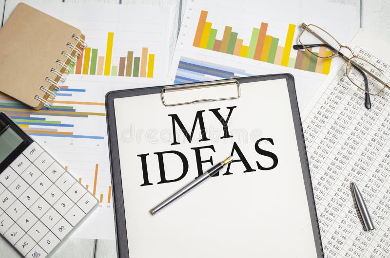 Word My Ideas on Paper Tablet with Pen and Calculator Stock Photo ...