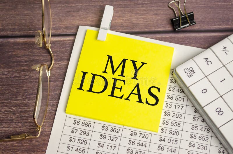 Word My Ideas on Yellow Sticker and Charts and Calculator Stock Photo ...