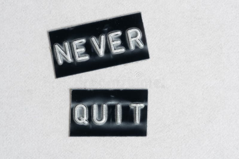 Word Never Quit on White Background Stock Photo - Image of ambition ...