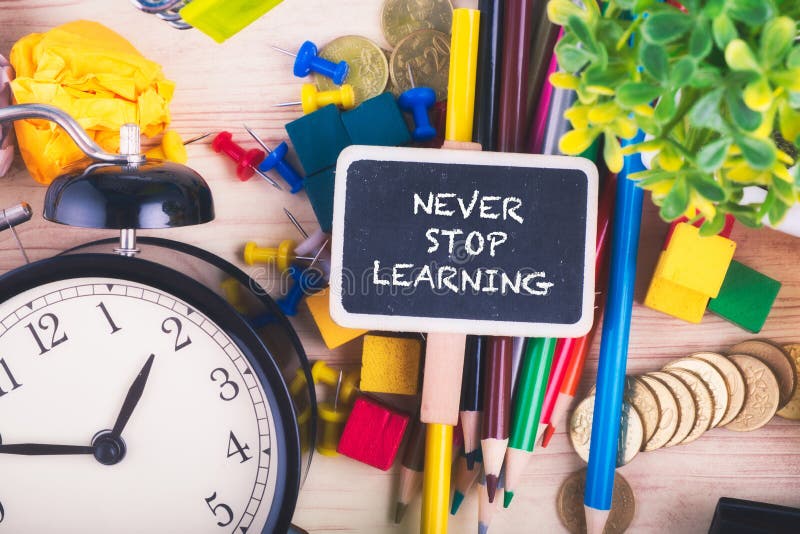 Word NEVER STOP LEARNING Over Scattered Wooden Workspace Stock Photo ...