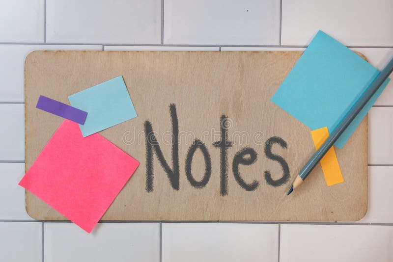 The Word Notes Painted on Wooden Sign with Posted Multiple Colored Note ...