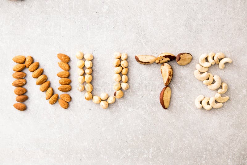 Word NUTS Spelled with Various Nuts on Stona Background. Assorted Mixed ...