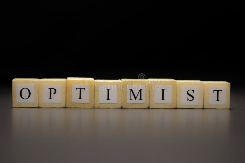The Word OPTIMIST Written on Wooden Cubes Isolated on a Black ...