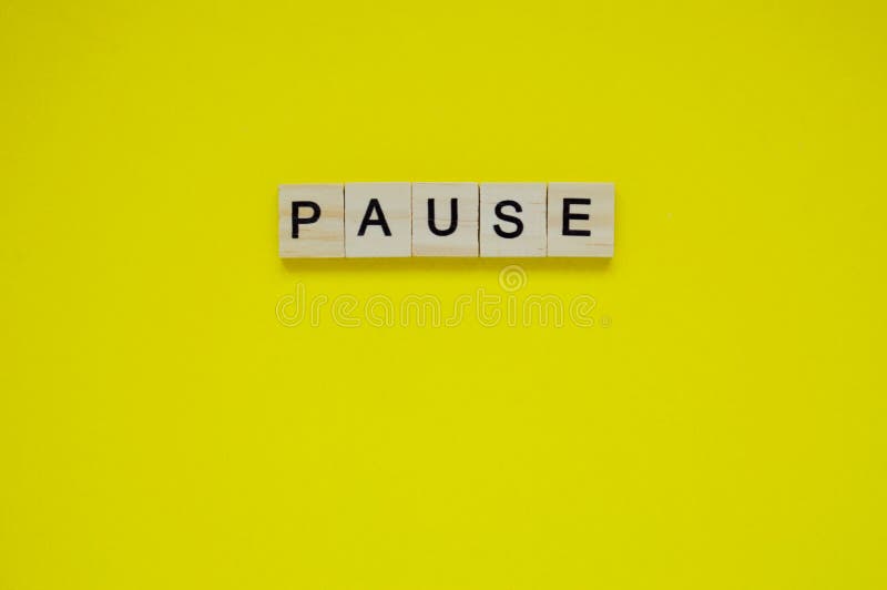 Word Pause. Top View of Wooden Blocks with Letters on Green Surface ...
