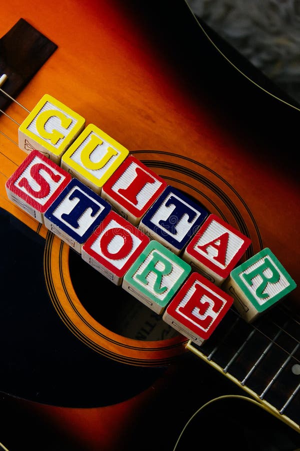 Word or Phrase Guitar Store Made with Letter Cubes, Standing on Guitar ...