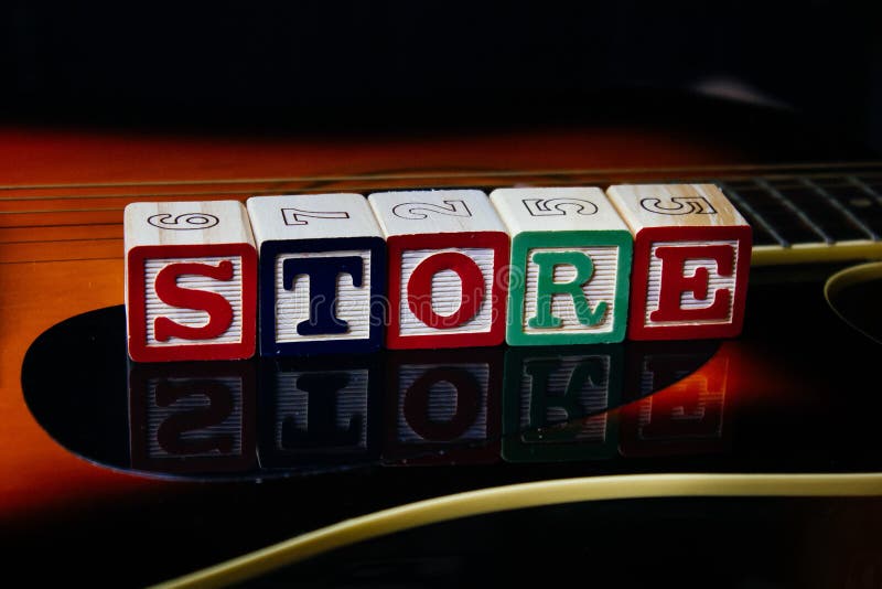 Word or Phrase Store Made with Letter Cubes, Standing on Guitar. Stock ...