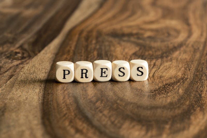Word PRESS on wooden cubes stock image. Image of decoration - 64184745